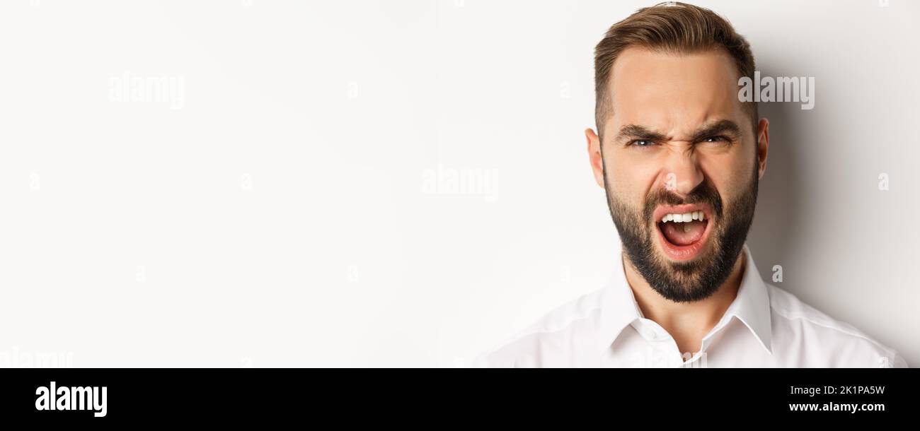 Emotions and people concept. Close-up of shocked bearded man reacting ...