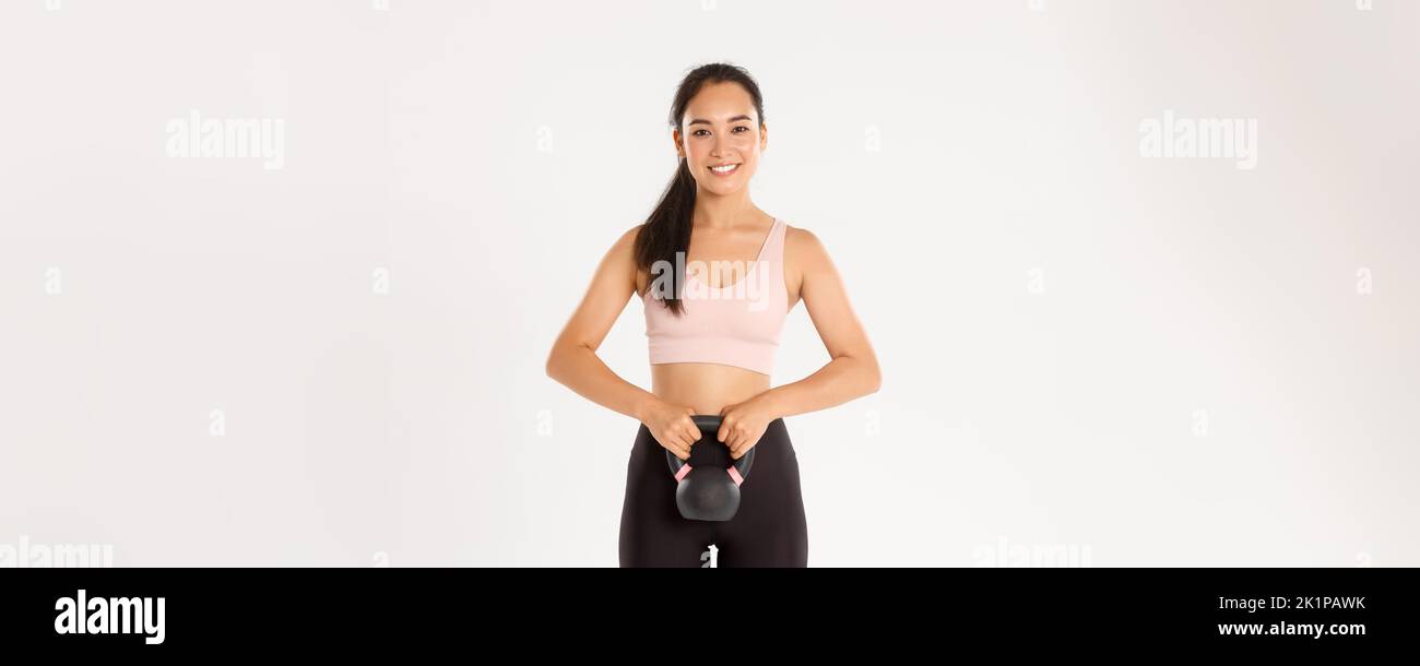 Sport, wellbeing and active lifestyle concept. Smiling strong and slim ...