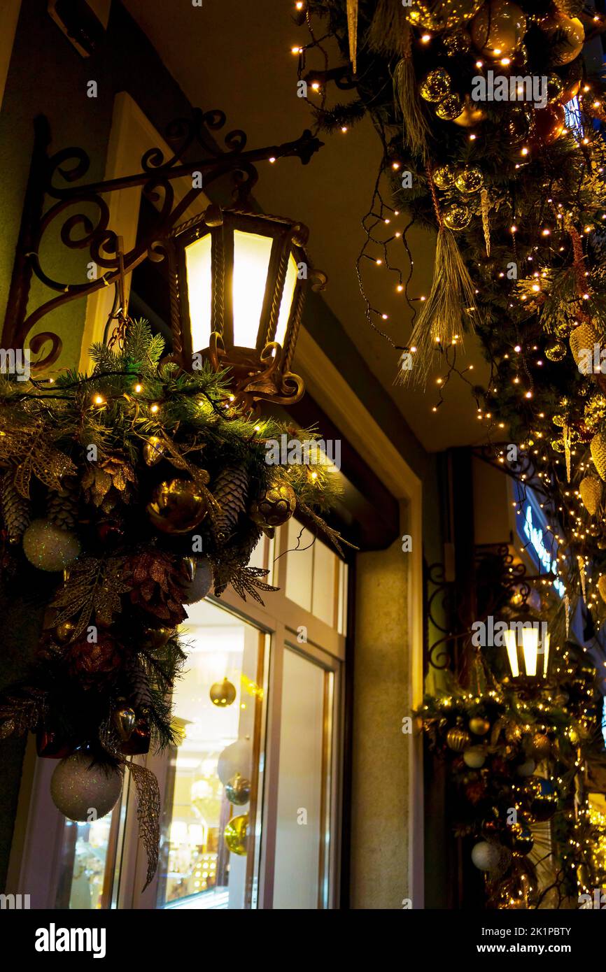 Christmas decorations and a Christmas tree in the windows of city shops ...