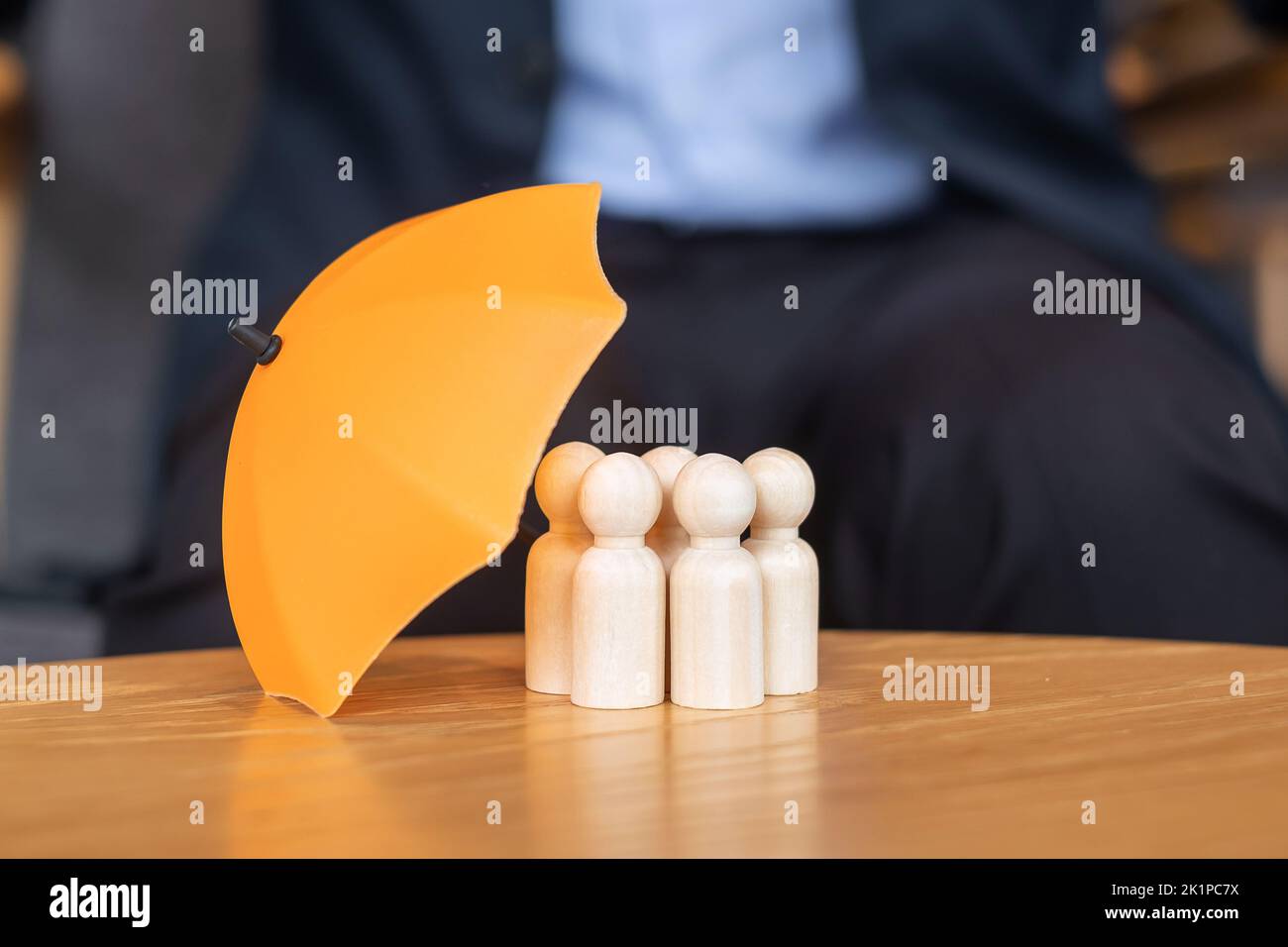 yellow umbrella cover man wooden from crowd of employees. People ...