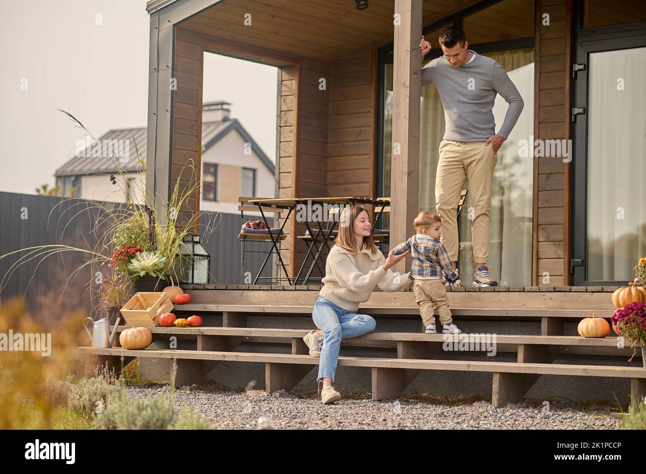 Parents spending time with their child in the countryside Stock Photo ...