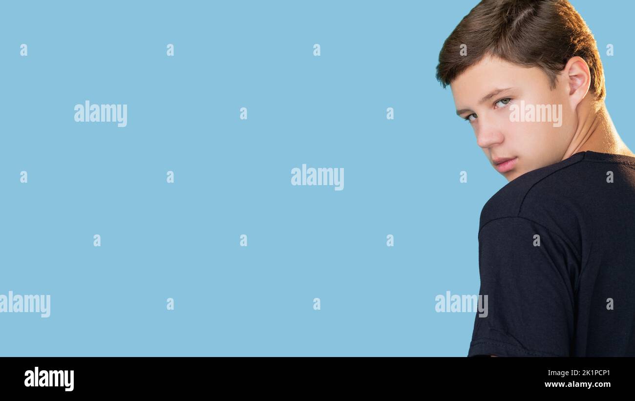 Suspicious teenager. Commercial background. Bullying offence. Portrait ...