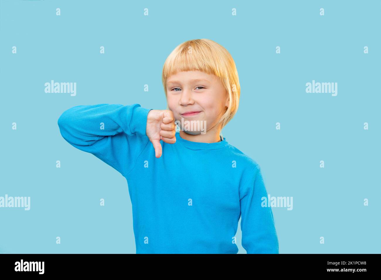 Skeptic kid. Dislike gesture. Refusal sign. Wrong choice. Portrait of ...