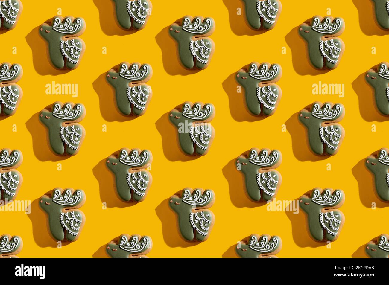 Green deer seamless pattern. Yellow art background. Cute symmetrical ...