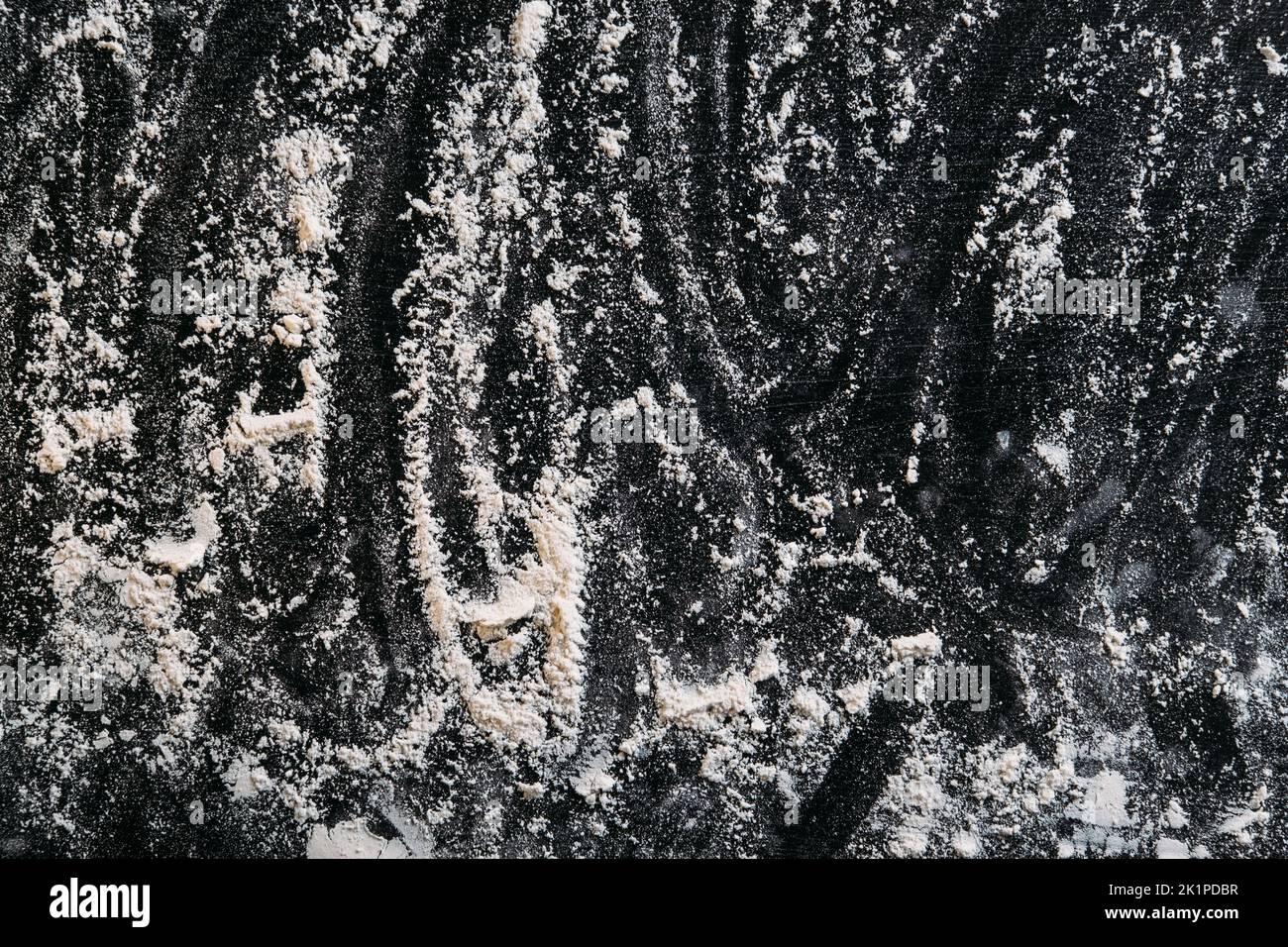 Black culinary background. Bakery desk. Dark table with flour powder ...