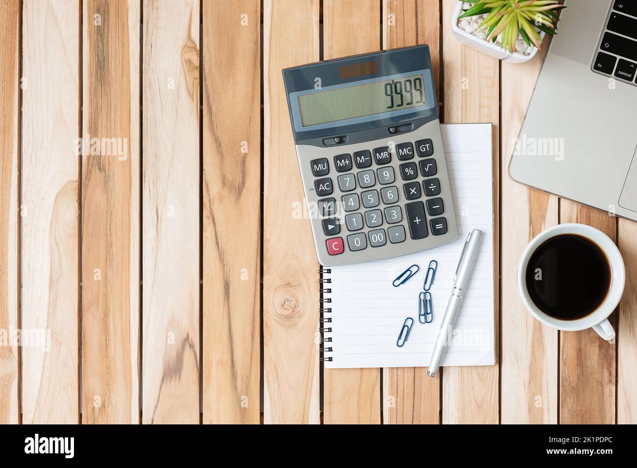Top view Office desk with calculator, pen, blank notebook, paperclip ...
