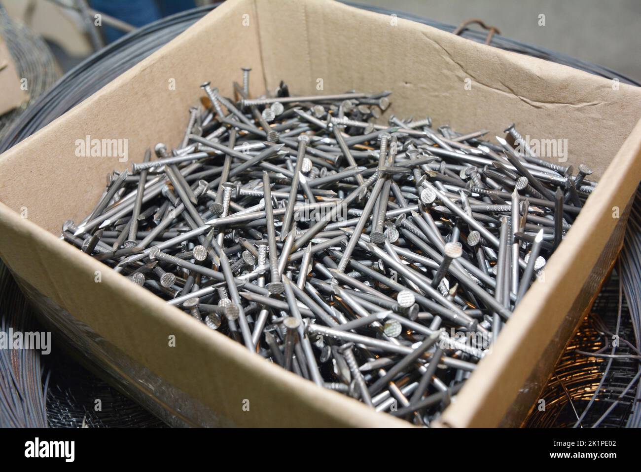 Metal nails in the box Stock Photo - Alamy