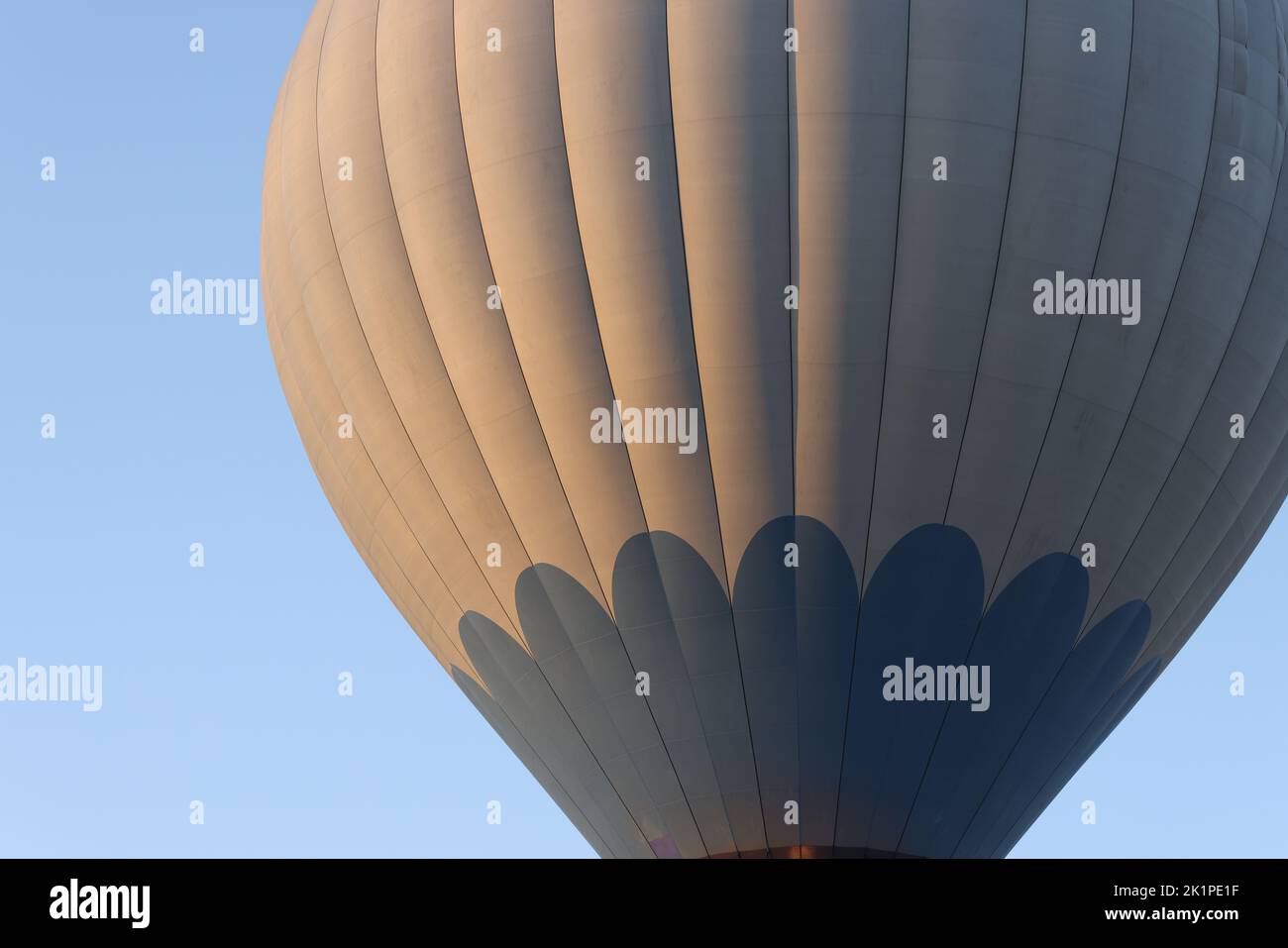 Hot air balloon flies on blue sky closeup Stock Photo - Alamy