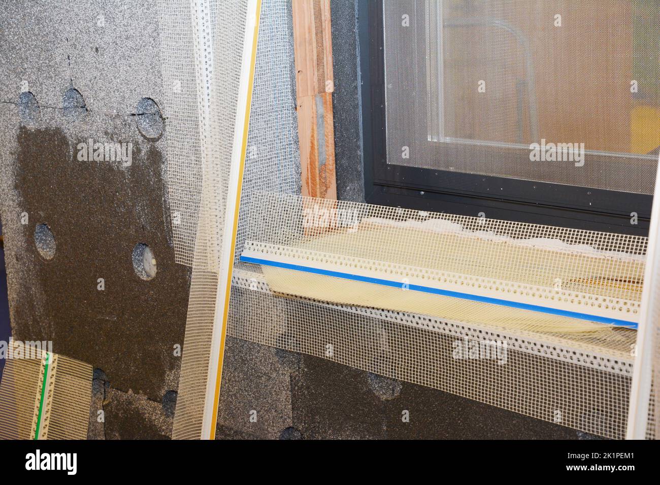 Window sill corner contruction with foam insulation, plastering layers ...