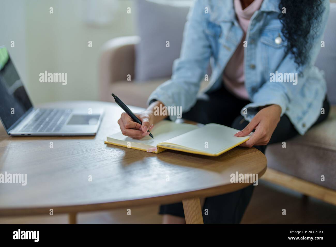 African Americans using notebooks, pens to take notes and computers ...