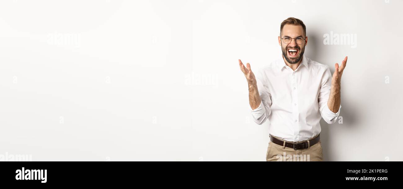 Frustrated and angry man screaming in rage, shaking hands furious ...