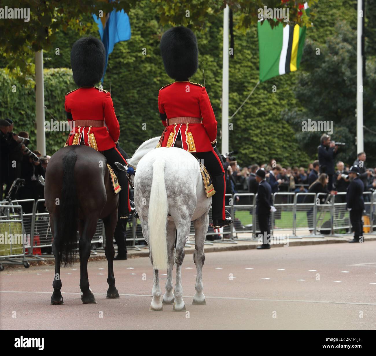 Guardsmen on horseback in their historic colourful uniforms accompany ...