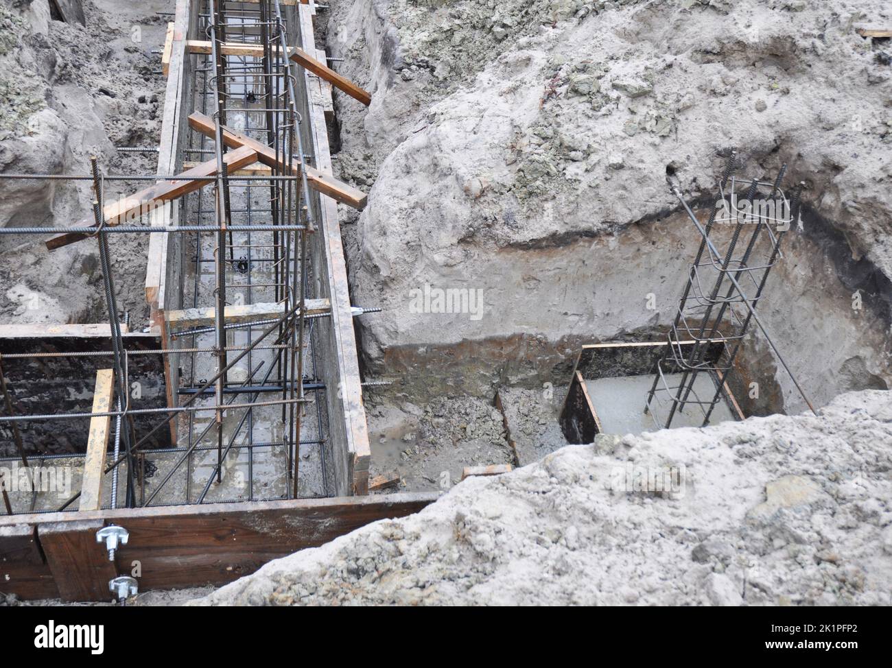 Iron and wooden framework to build a house foundation uder construction ...