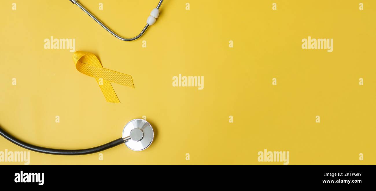 Yellow Ribbon and Stethoscope on yellow background for supporting ...
