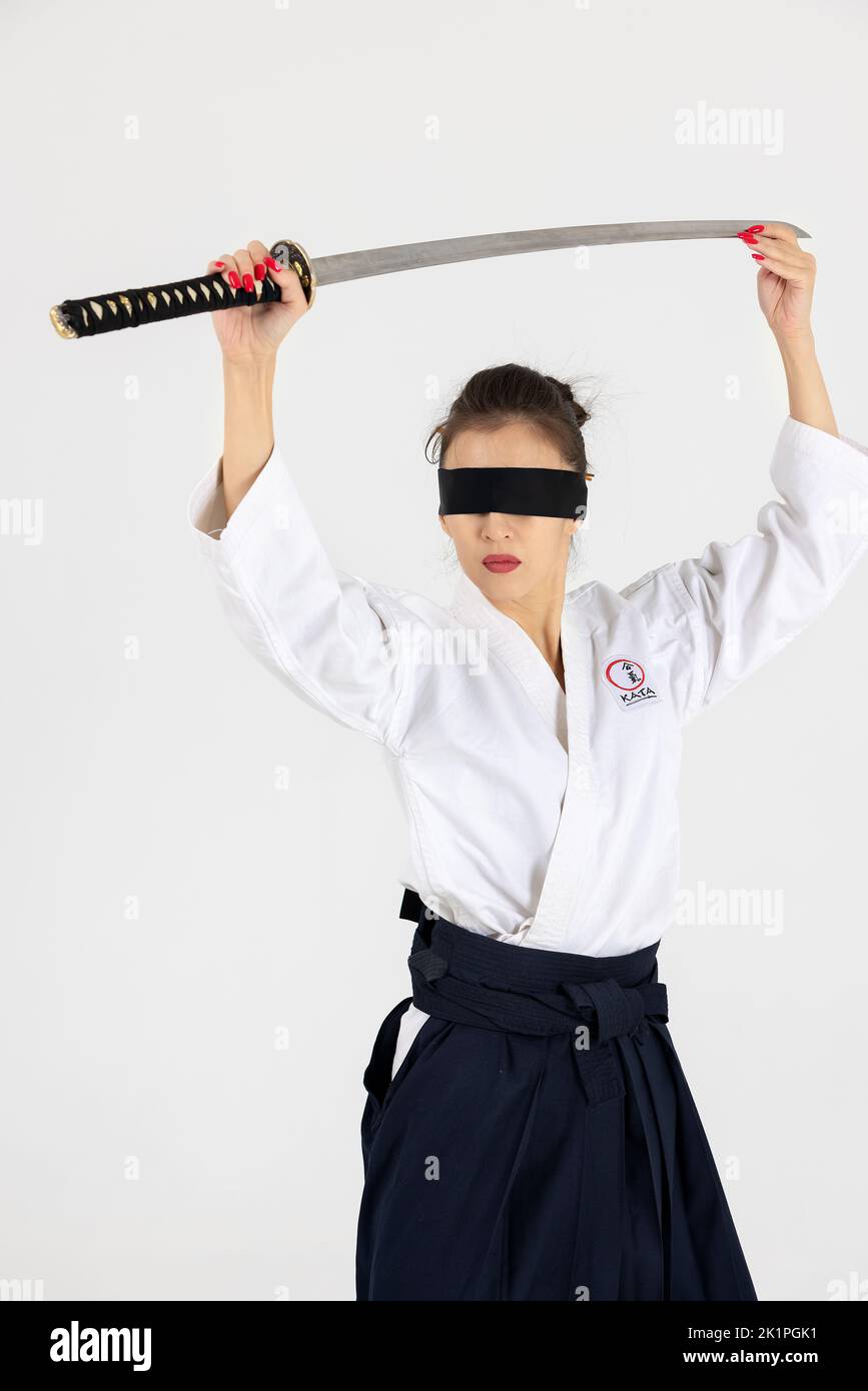 Aikido master woman in traditional samurai hakama kimono with black ...