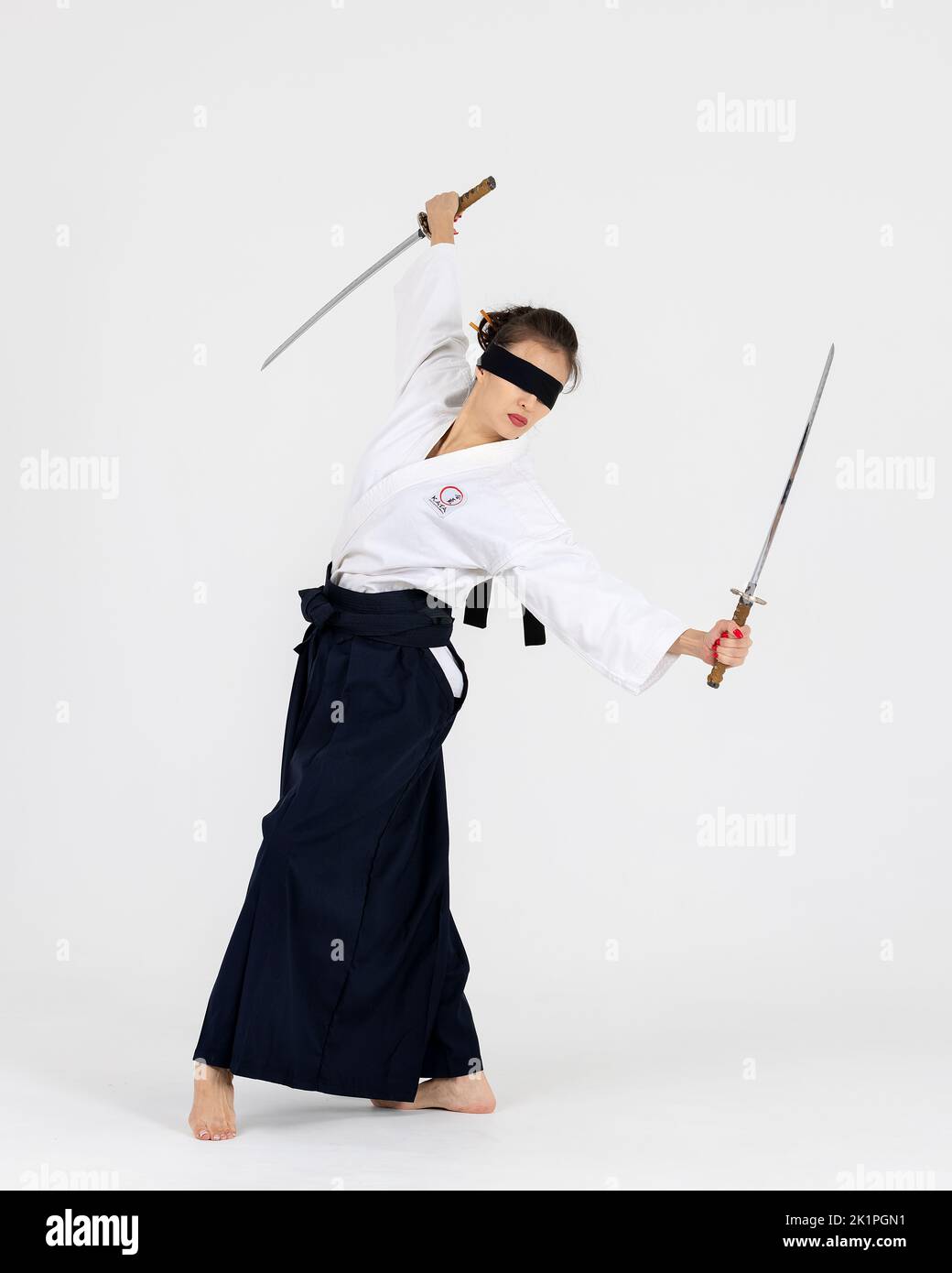 Aikido master woman in traditional samurai hakama kimono with black ...