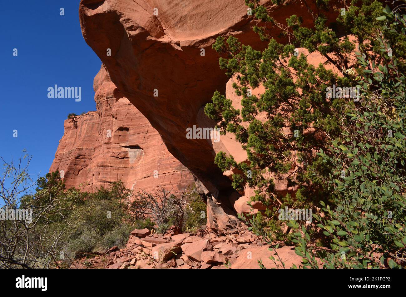 Small red rock cliff with falling rocks in Sedona Arizona in the winter ...