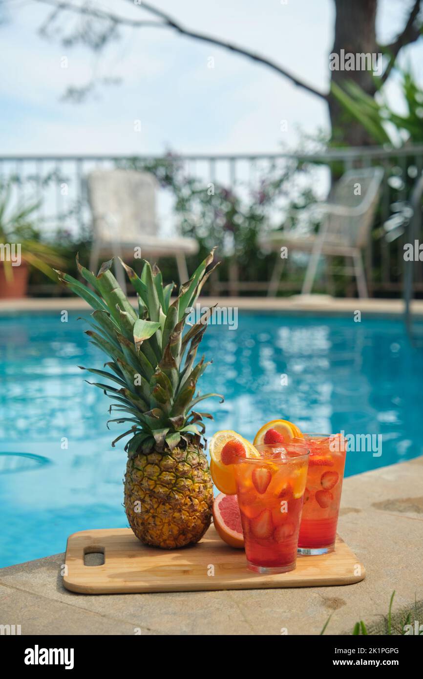 fruit cocktails by the pool Stock Photo - Alamy