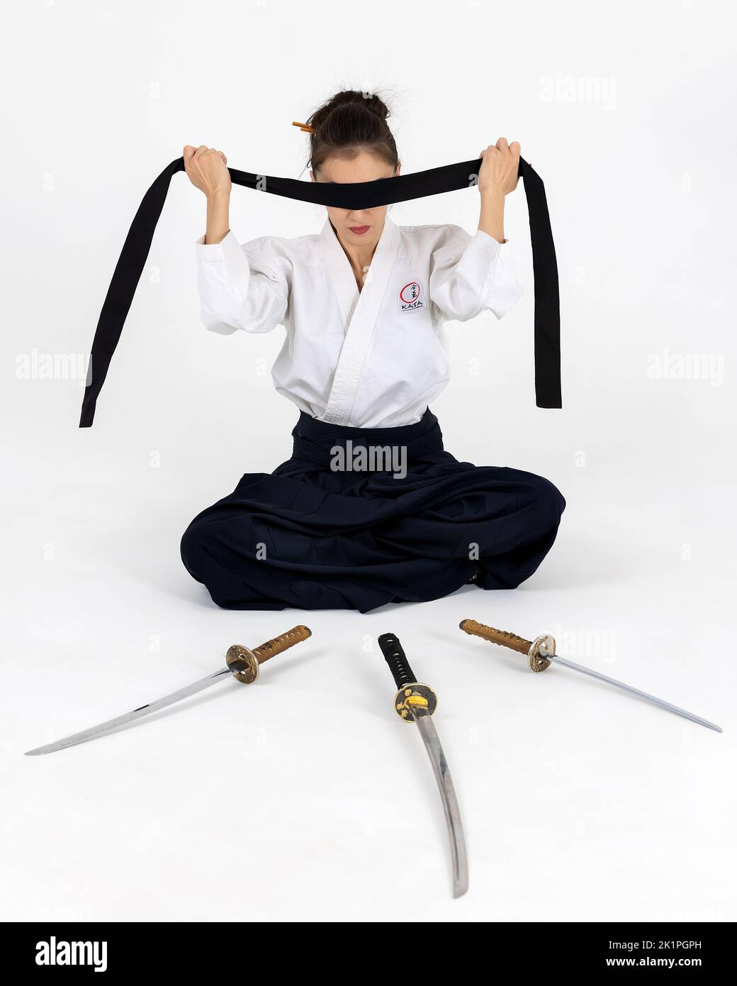 Aikido master woman in traditional samurai hakama kimono with black ...