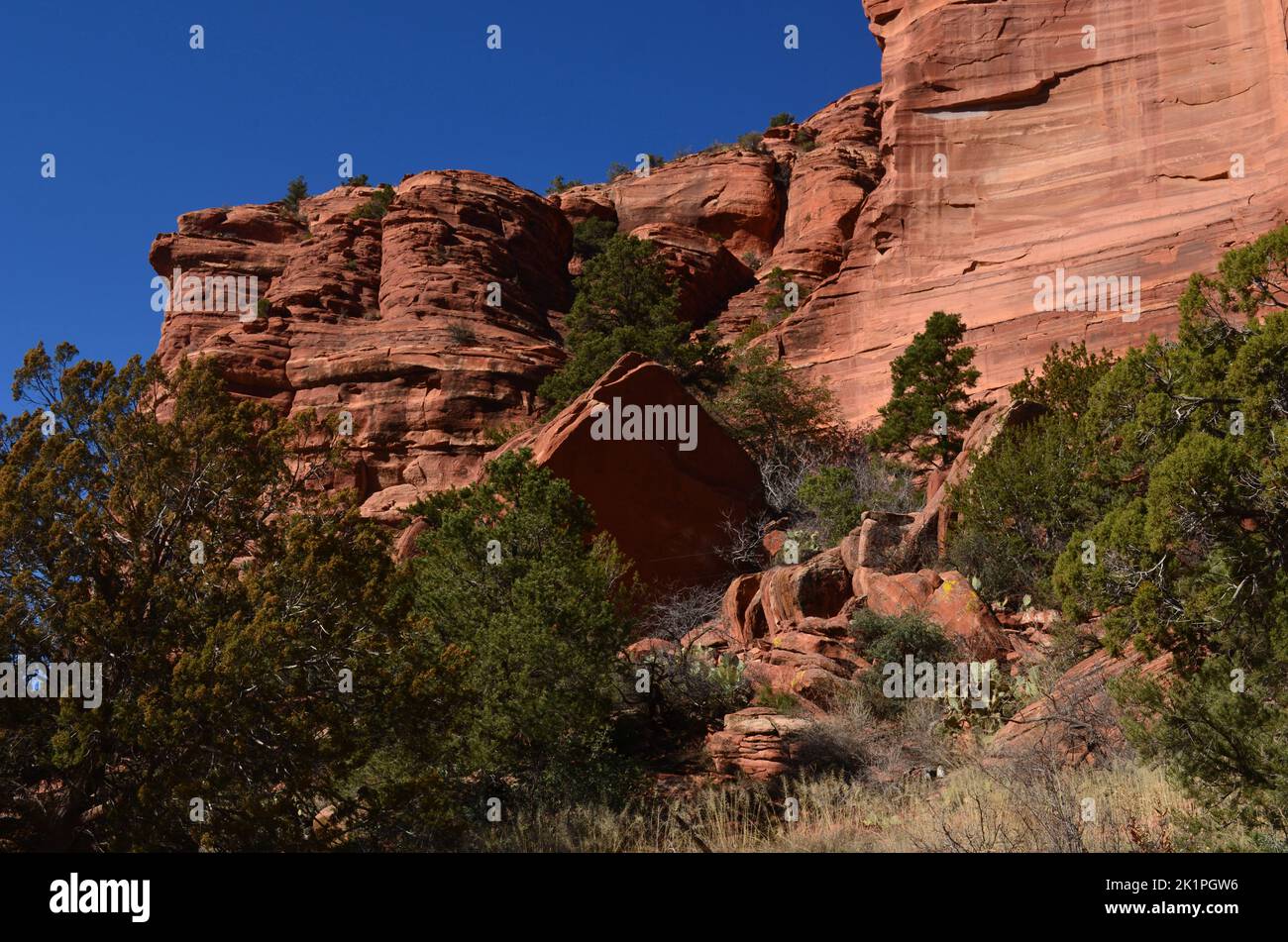 Dark blue skies over textured red rock formation in the southwest of ...