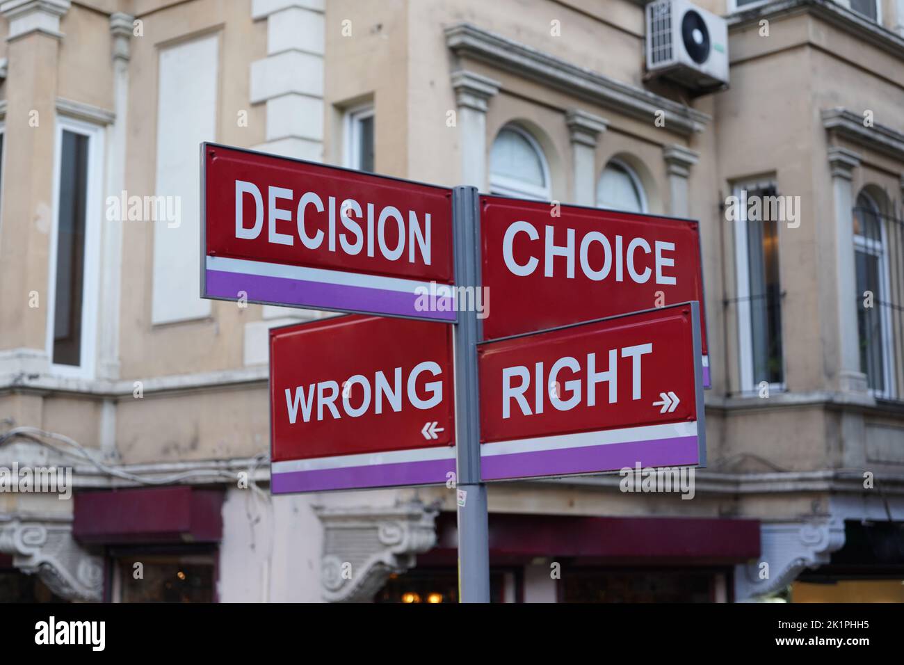 Four street signs, sign post, sign the post with four signs in front of ...