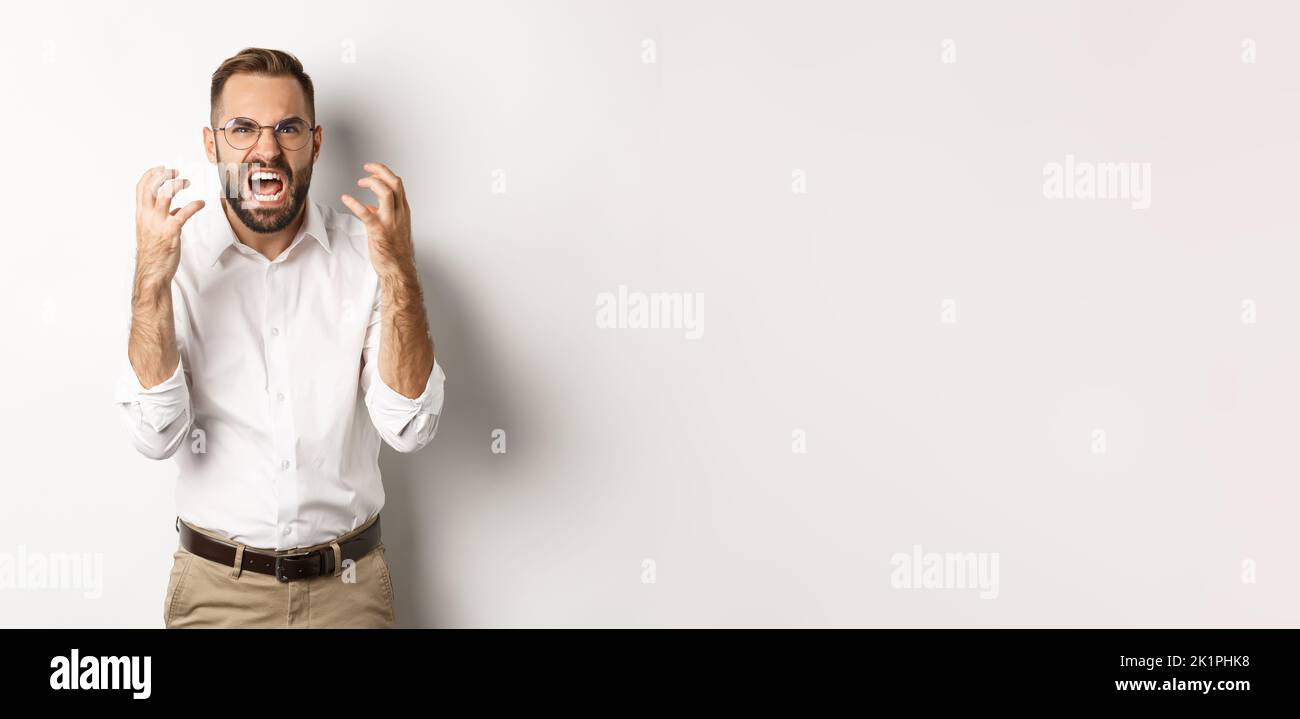 Frustrated and angry man screaming in rage, shaking hands furious ...