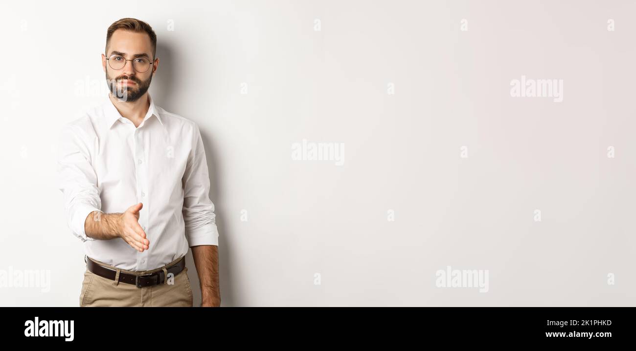 Confident businessman stretch hand for handshake, greeting business ...