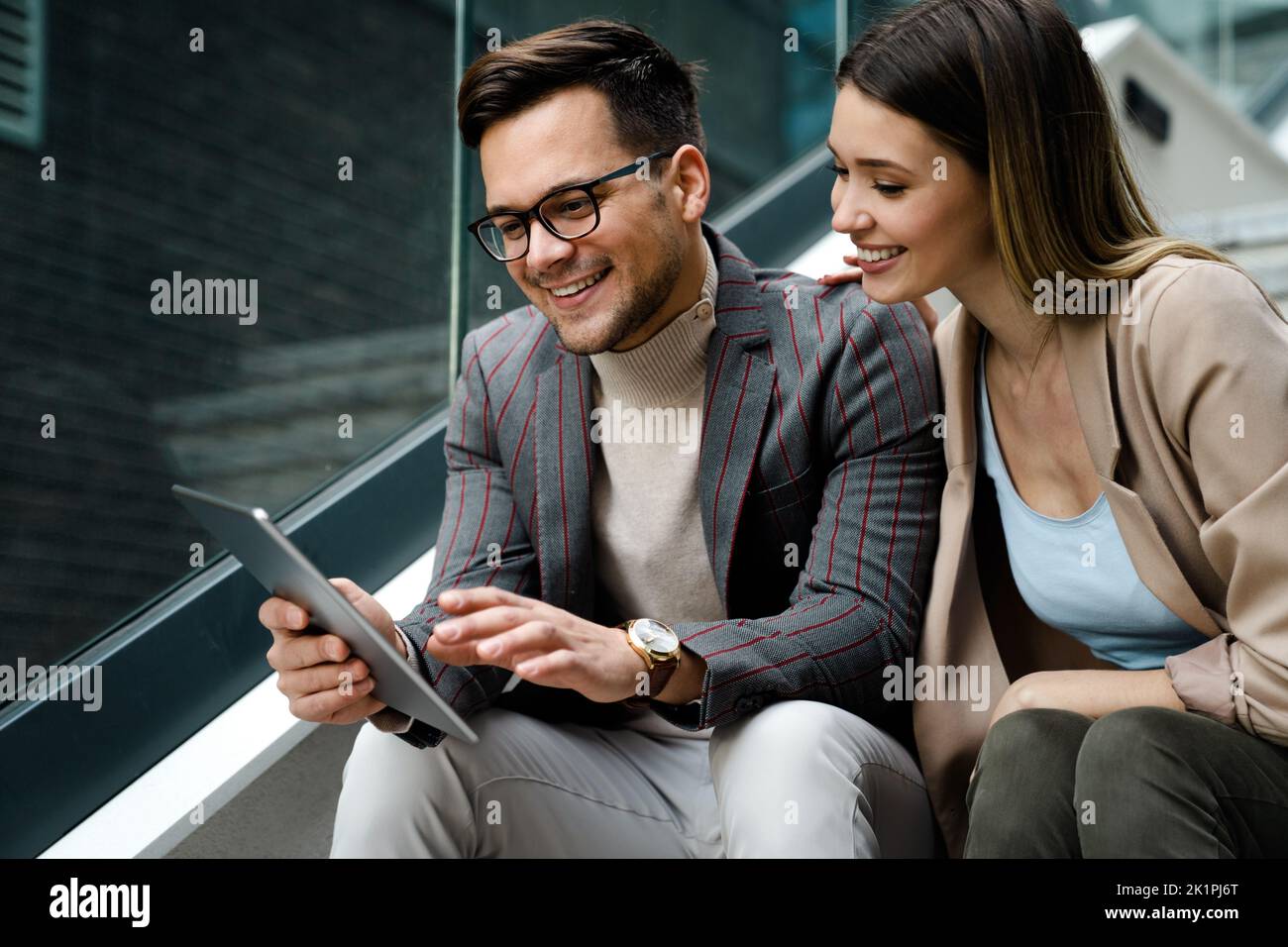 Successful business people, designer enjoying work together. Business ...