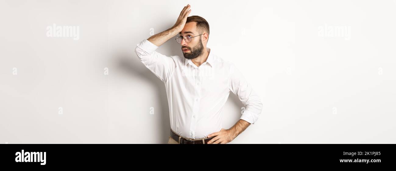 Annoyed man manager roll his eyes and slap forehead, facepalm from ...