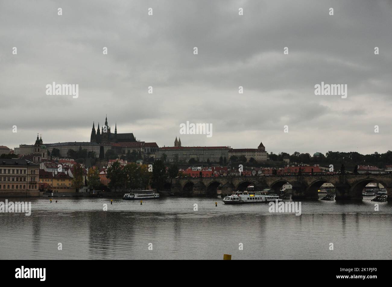 The view of the Vltava River and Charles Bridge in the rain. Prague ...
