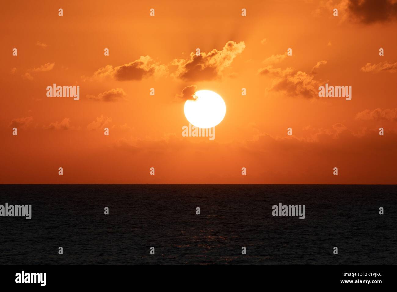 A sad sunset view in Kocaeli, Kefken. Big bright solar disk among the ...