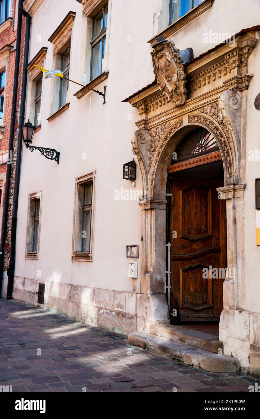 Renaissance carved stone arch pediment in Krakow, Poland Stock Photo ...