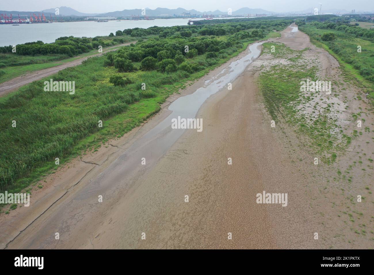 A large area of dry beach emerges from the Zhenjiang section of the ...