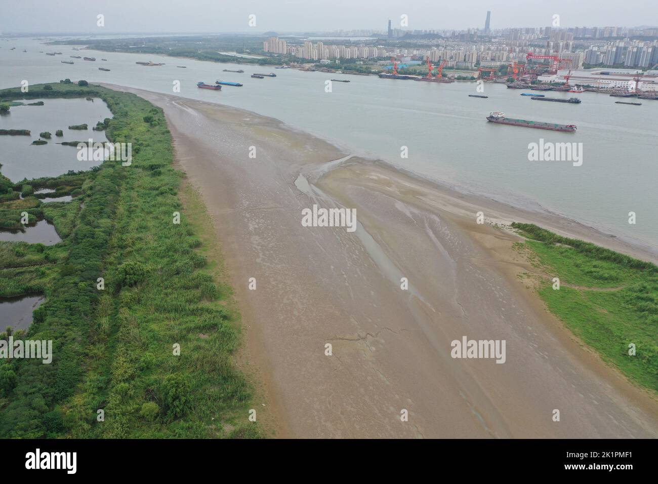 A large area of dry beach emerges from the Zhenjiang section of the ...