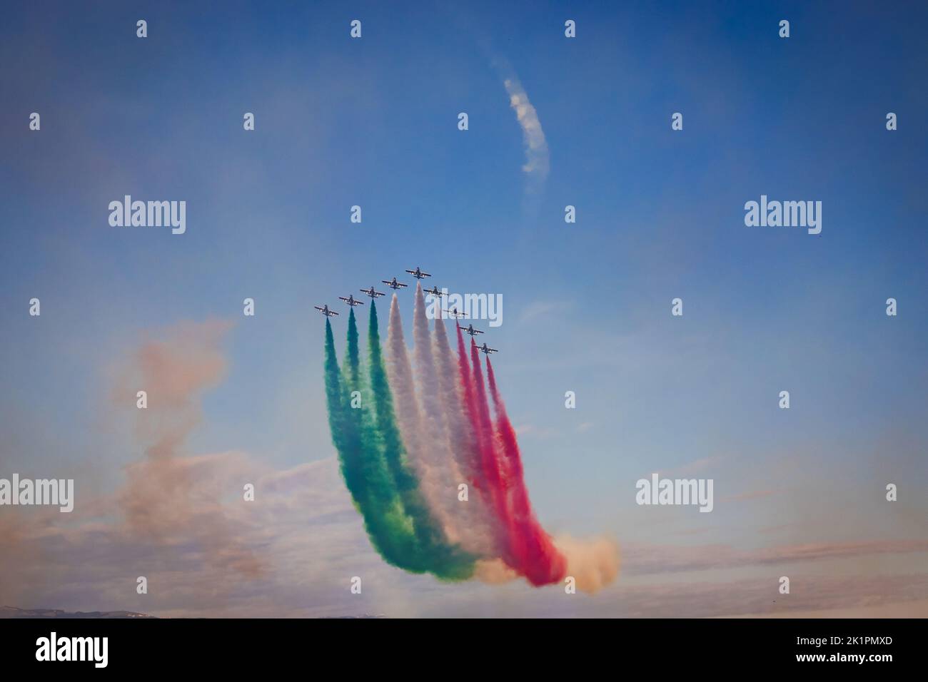 The Freccie Tricolori rolling in the blue sky Stock Photo - Alamy