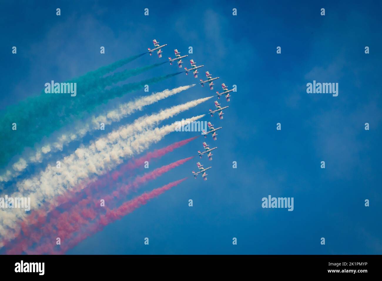 The Freccie Tricolori rolling in the blue sky Stock Photo - Alamy