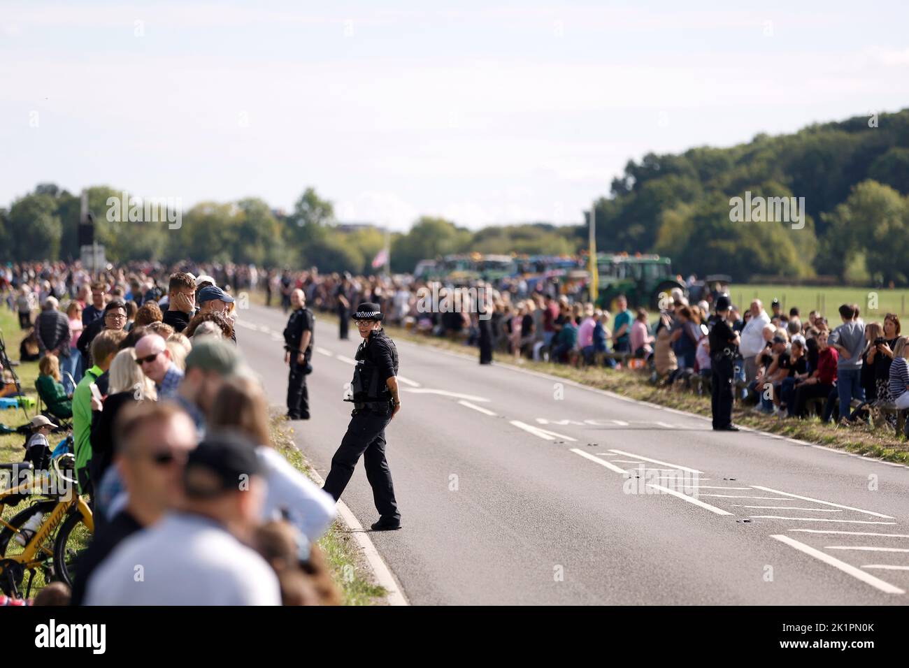 Police and members of the public wait for the State Hearse carriying ...