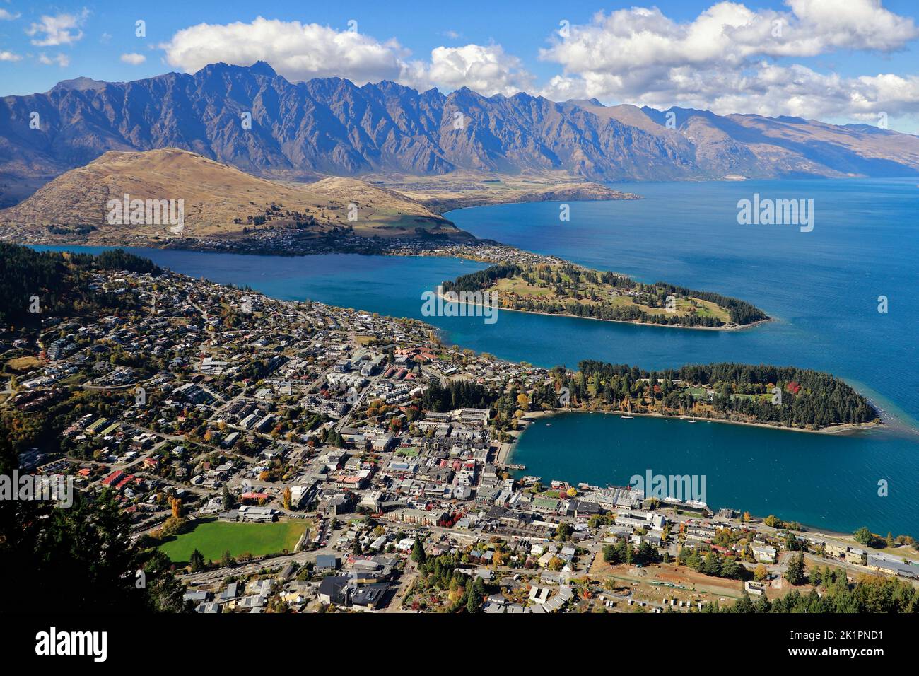 An aerial drone view of the Queenstown surrounded by beautiful ...