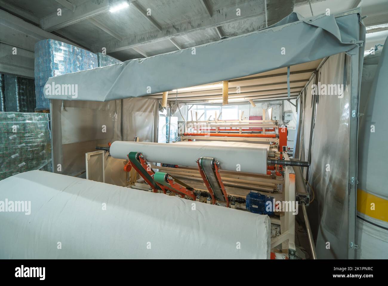 Automated machine at factory for production of toilet paper and other ...