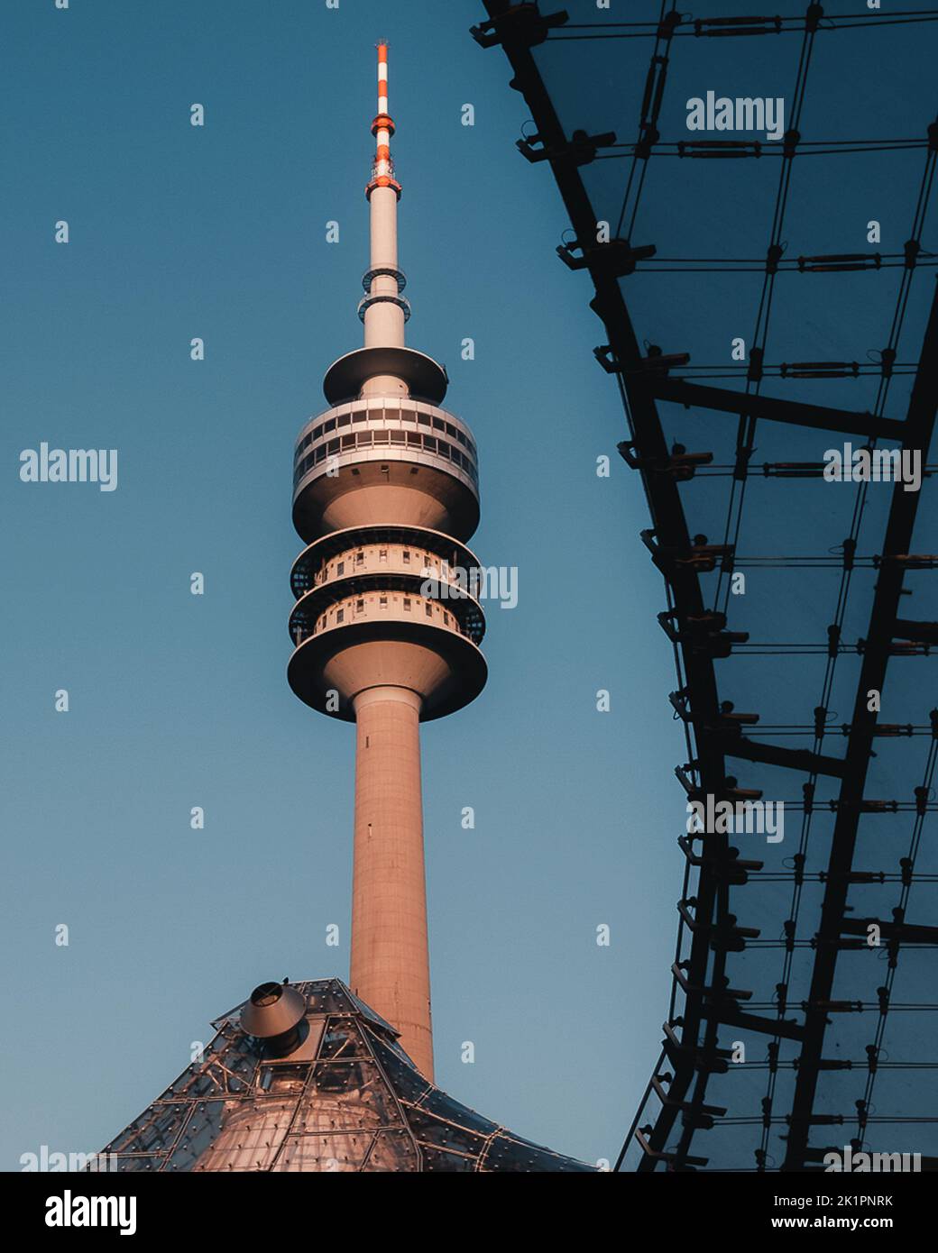 The famous Olympiaturm tower in Munich against a blue sky Stock Photo - Alamy