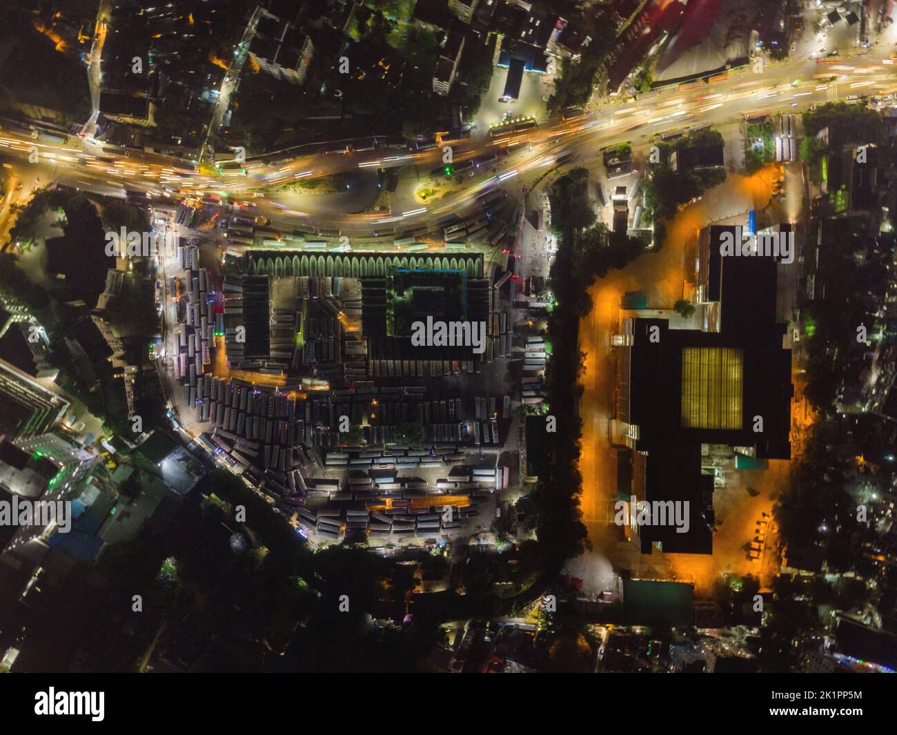An aerial view of a bus terminal at night Stock Photo - Alamy