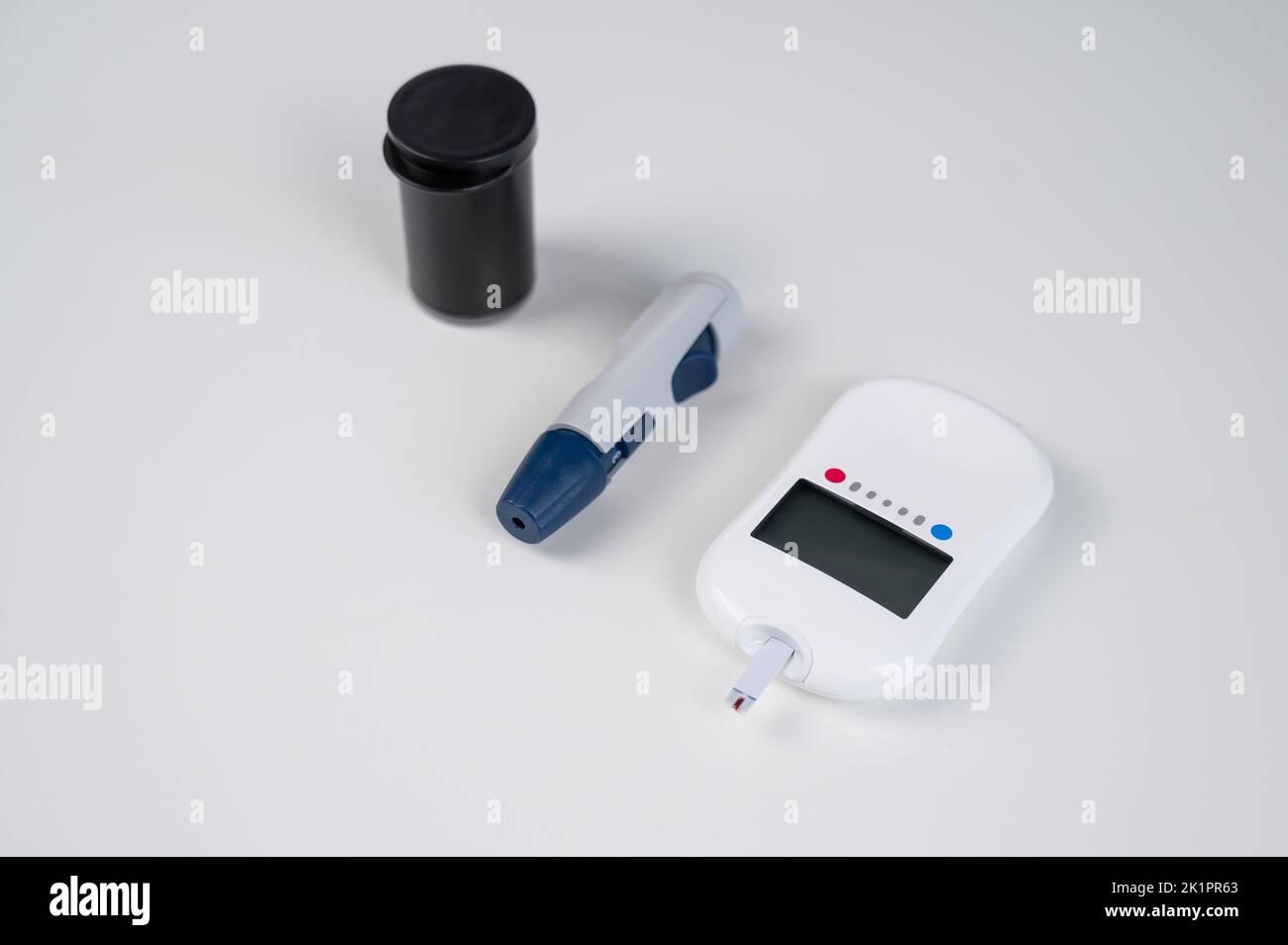 Home blood glucose test kit. Glucometer, lancet pen, needles and text ...