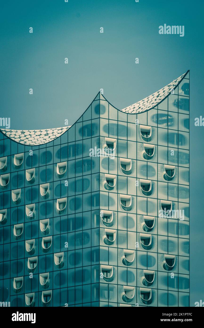 A vertical shot of the glass Elbphilharmonie building exterior in ...