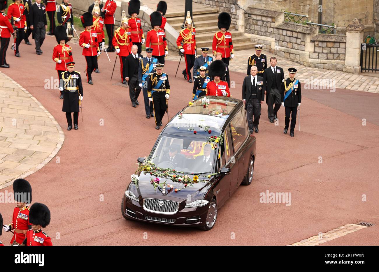 Members of the royal family walk behind the State Hearse carrying the ...
