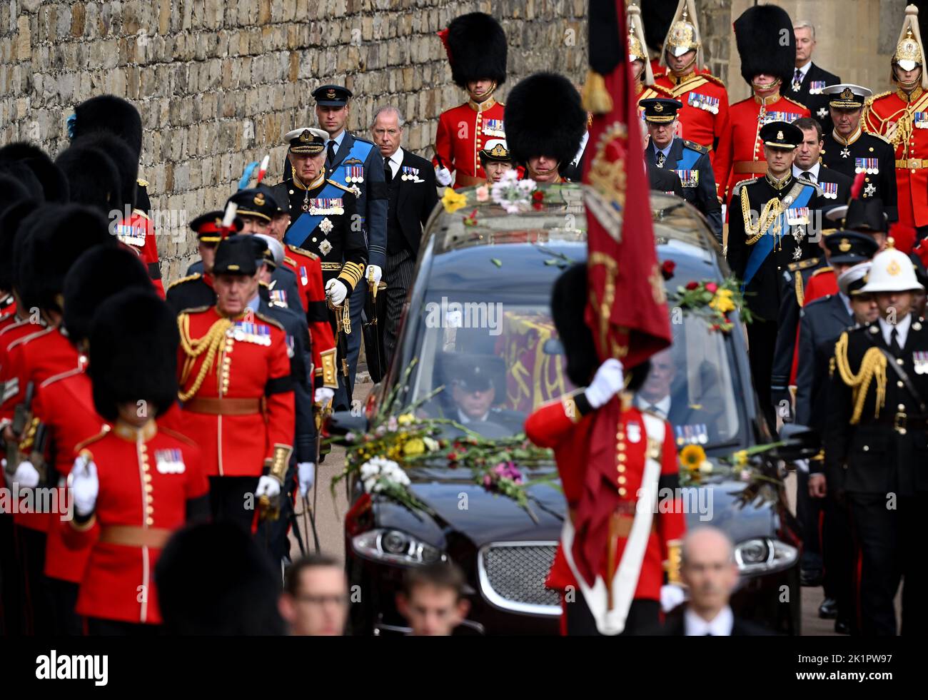 Members of the Royal family walk behind the State Hearse carrying the ...