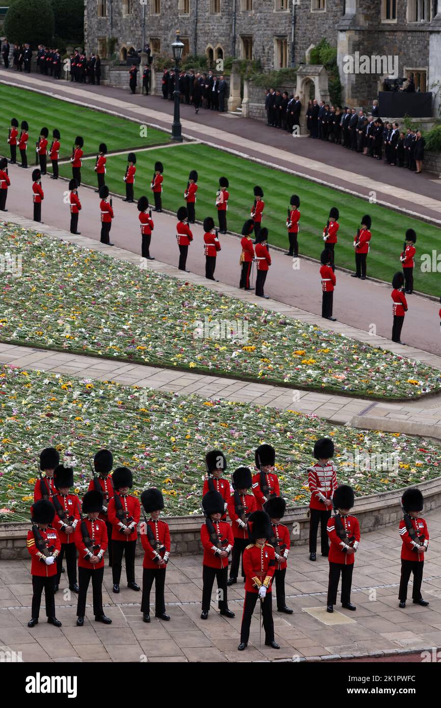Royal Guards stand guard as guests wait for the Committal Service for ...