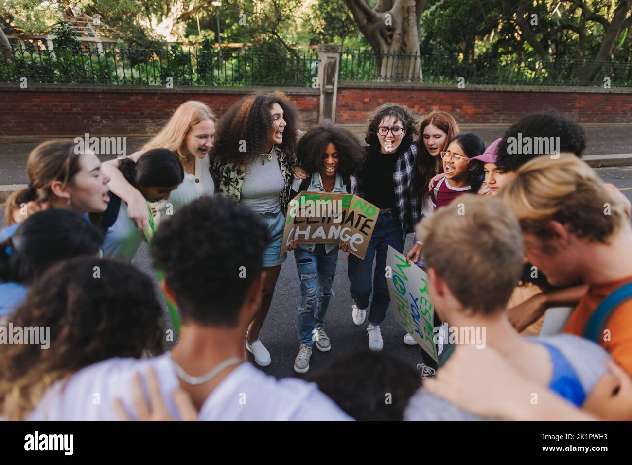 Diverse teenage activists standing up against climate change. Group of ...