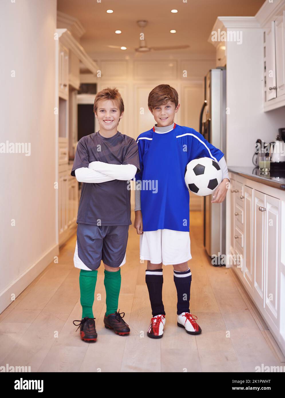 Boys will be boys. Portrait of two young boys in sports clothing ...