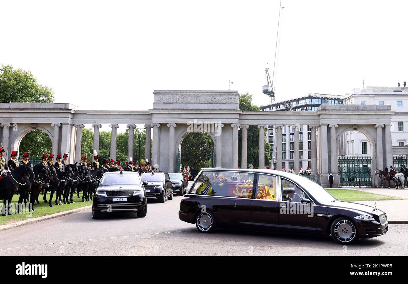 Members of the Royal Horse Artillery stand guard as the State Hearse leaves Wellington Arch in ...