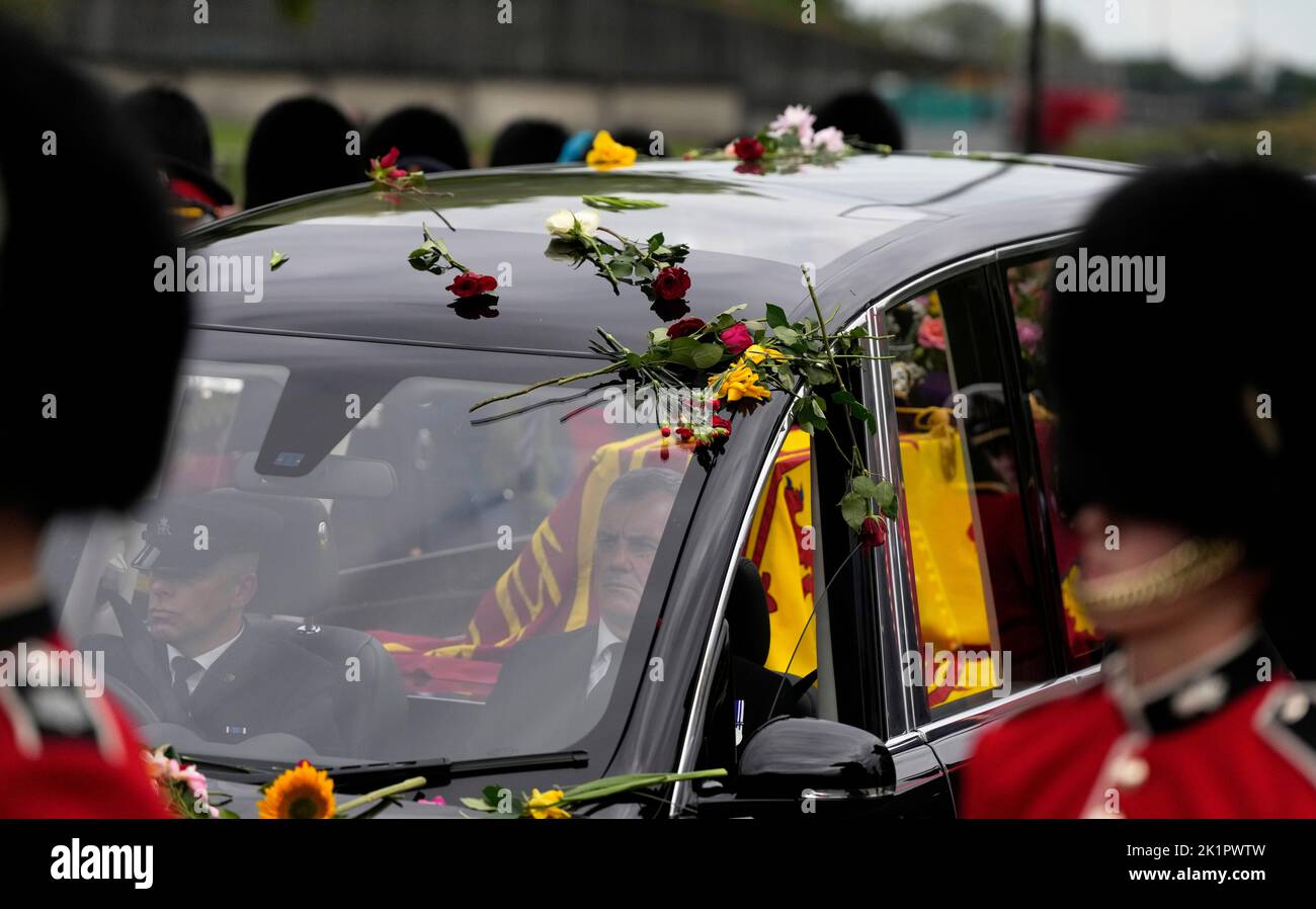 The State Hearse carries the coffin of Queen Elizabeth II, draped in the Royal Standard with the ...